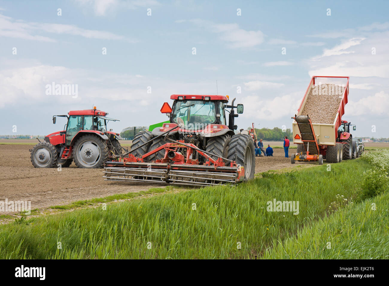 Farmers at work at their land Stock Photo - Alamy