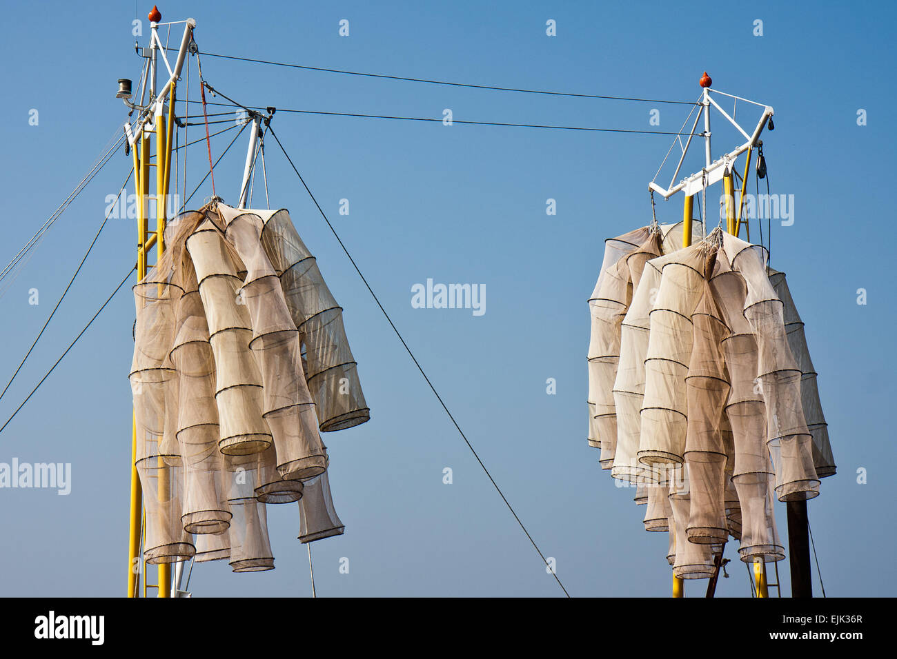 Fishing ship with nets drying in the sun Stock Photo - Alamy