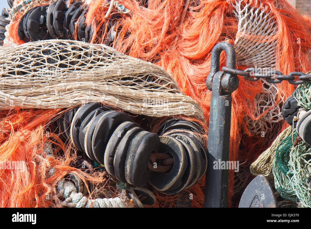 Big pile of fishing nets and an anchor Stock Photo - Alamy