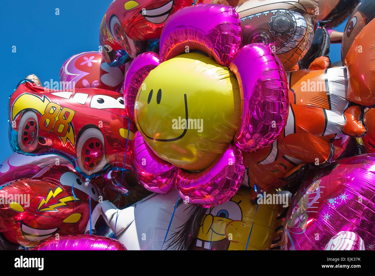 Colorful balloons wating for the kids at a party Stock Photo - Alamy