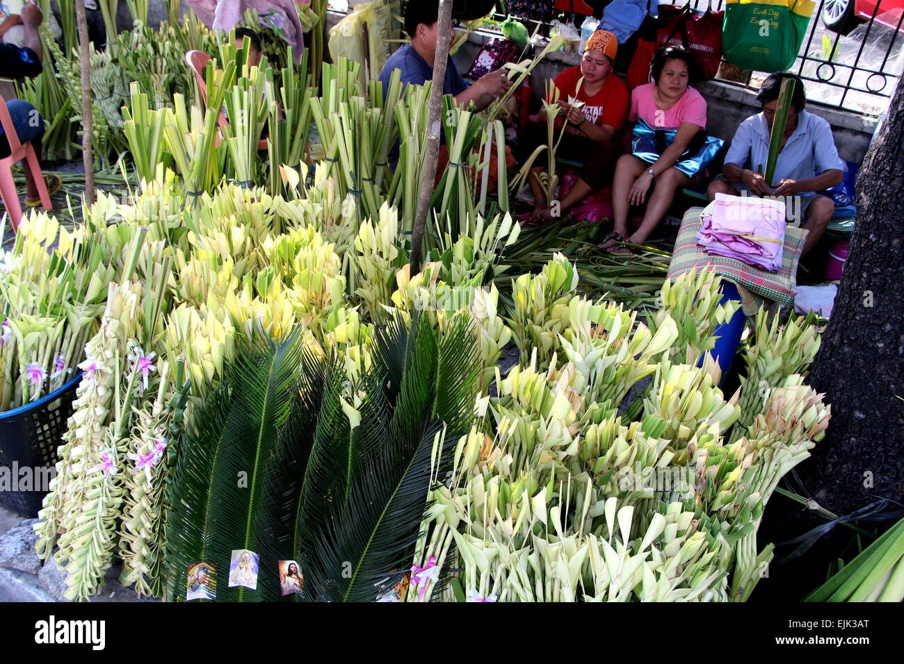 Manila, Philippines. 28th Mar, 2015. A “Palaspas” vendor's arranged the ...