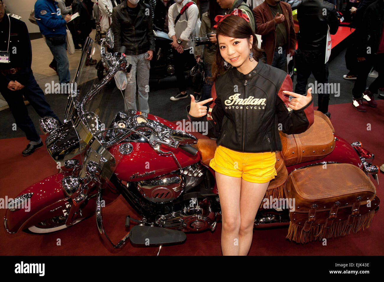 Tokyo, Japan. 28th March, 2015. An exhibitor poses for a picture during ...