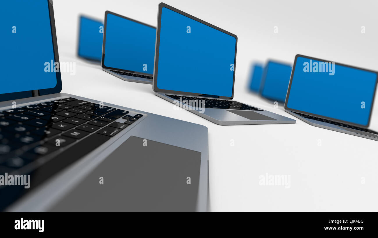 Many laptops in a circle isolated on white. Shallow depth of field ...