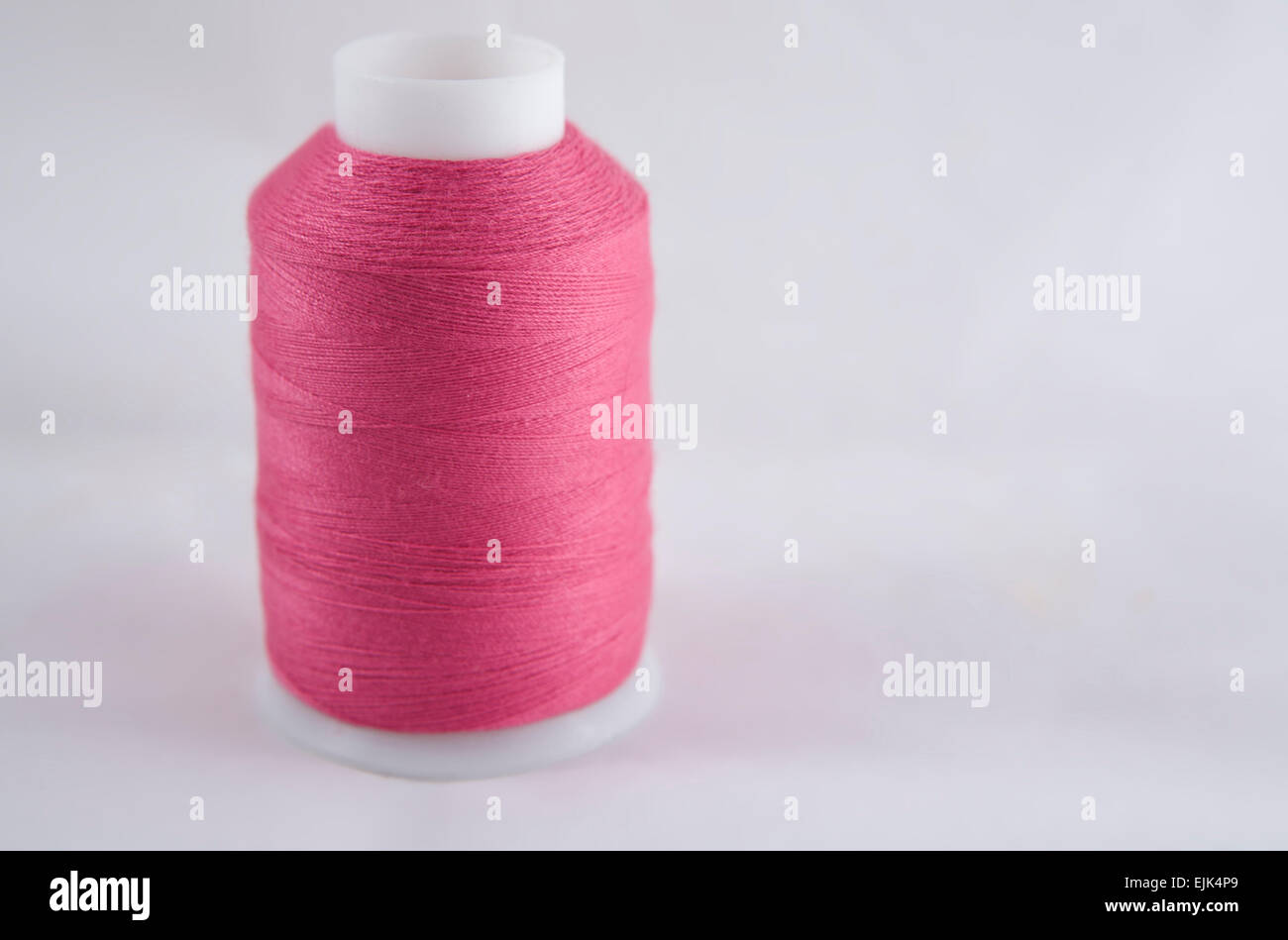 Spool of thread on white hi-res stock photography and images - Alamy