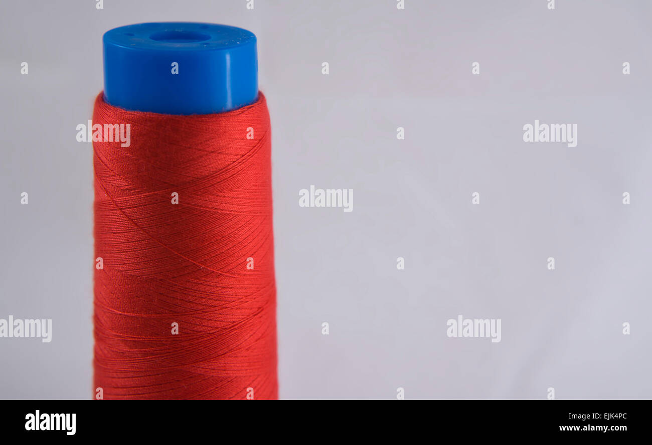 Cotton thread on spool isolated on white background Stock Photo - Alamy