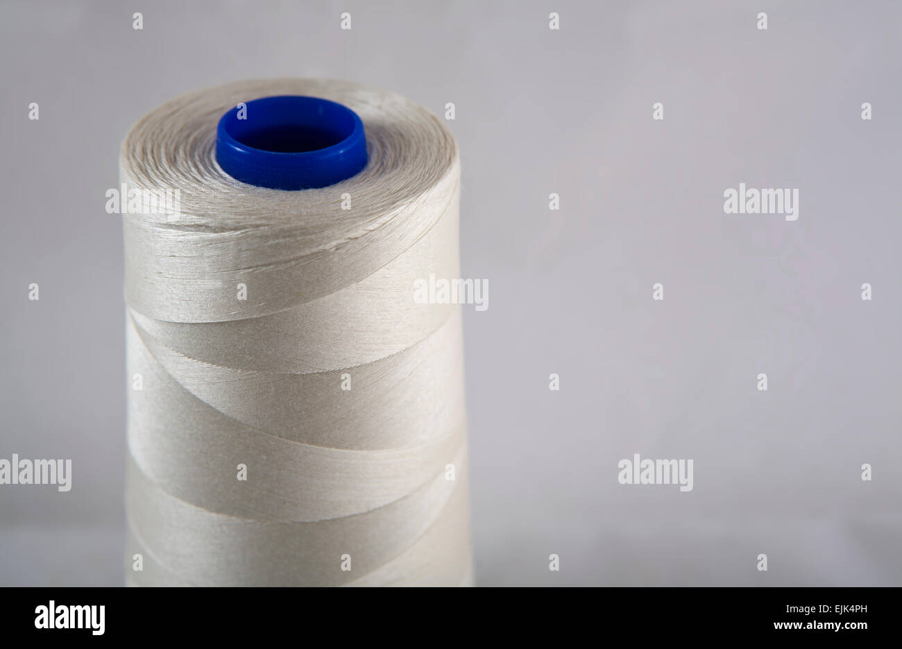 Cotton thread on spools isolated on white background Stock Photo - Alamy