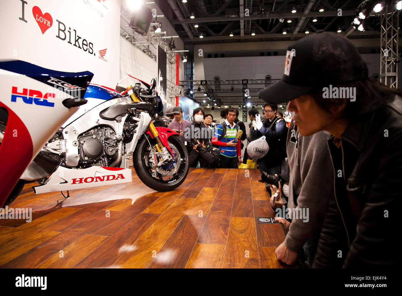 Tokyo, Japan. 28th March, 2015. Visitors look at a Honda RC213V-S ...