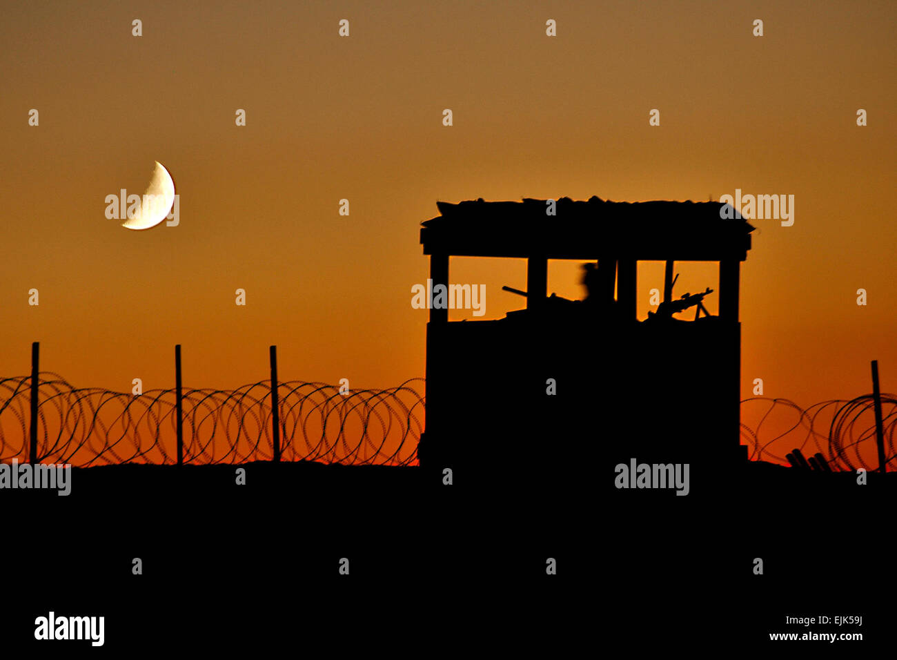 A Soldier mans a security outpost at a construction site. Active duty ...