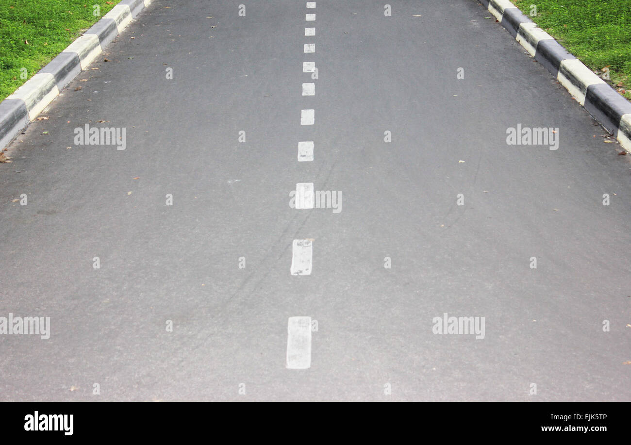Empty asphalt road. Along the grey road. Open road ahead, endless road ...