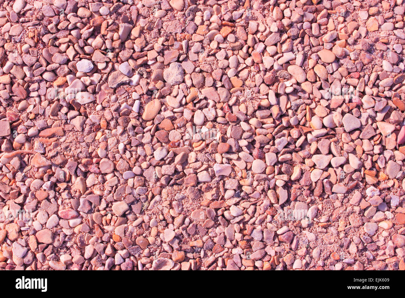 Pebble background at sun light. Stone texture Stock Photo - Alamy