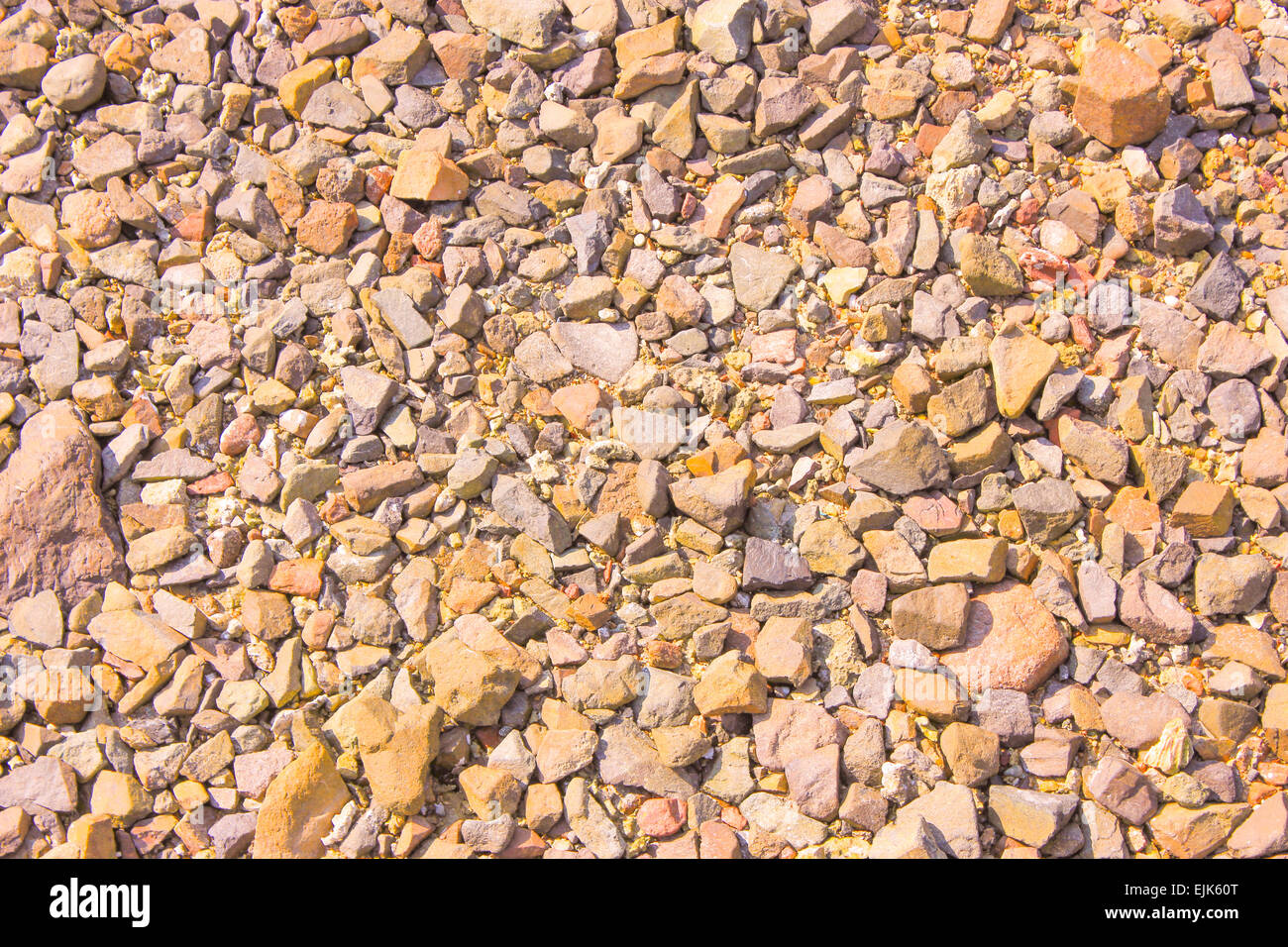 Pebble background at sun light. Stone texture Stock Photo - Alamy