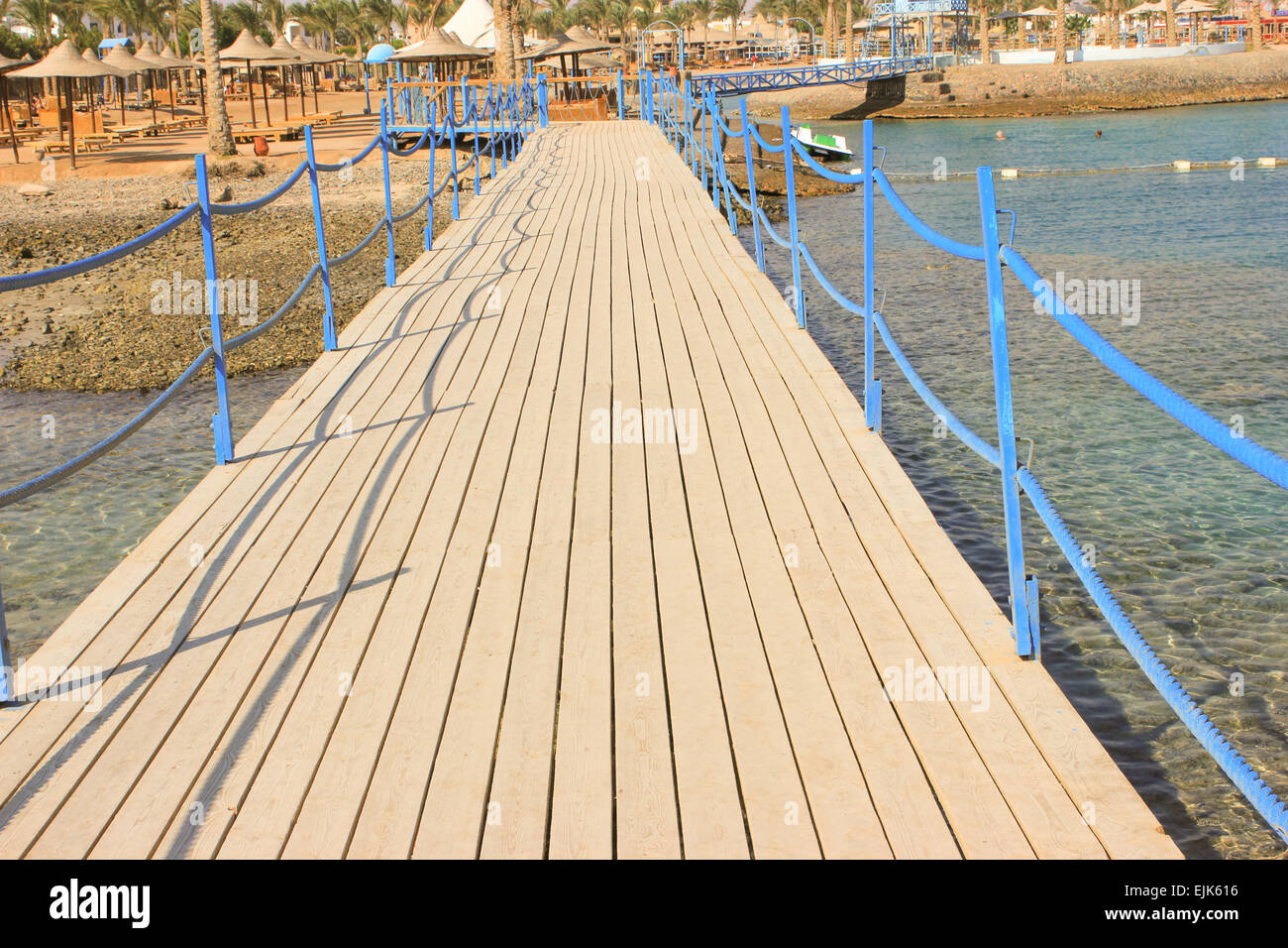 Wooden bridge on the beach shore Stock Photo - Alamy