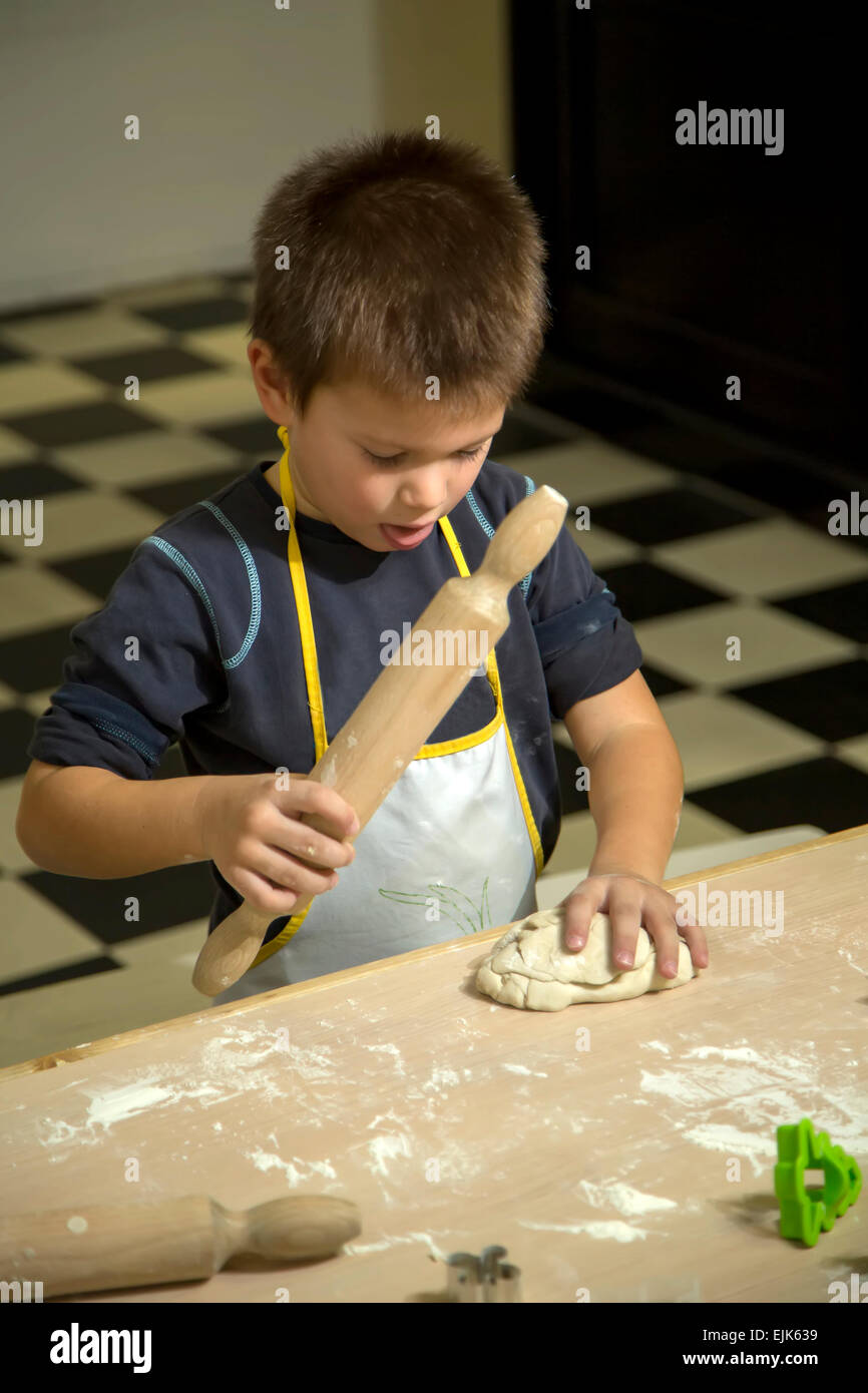 Boy making cakes in the kichen Stock Photo - Alamy
