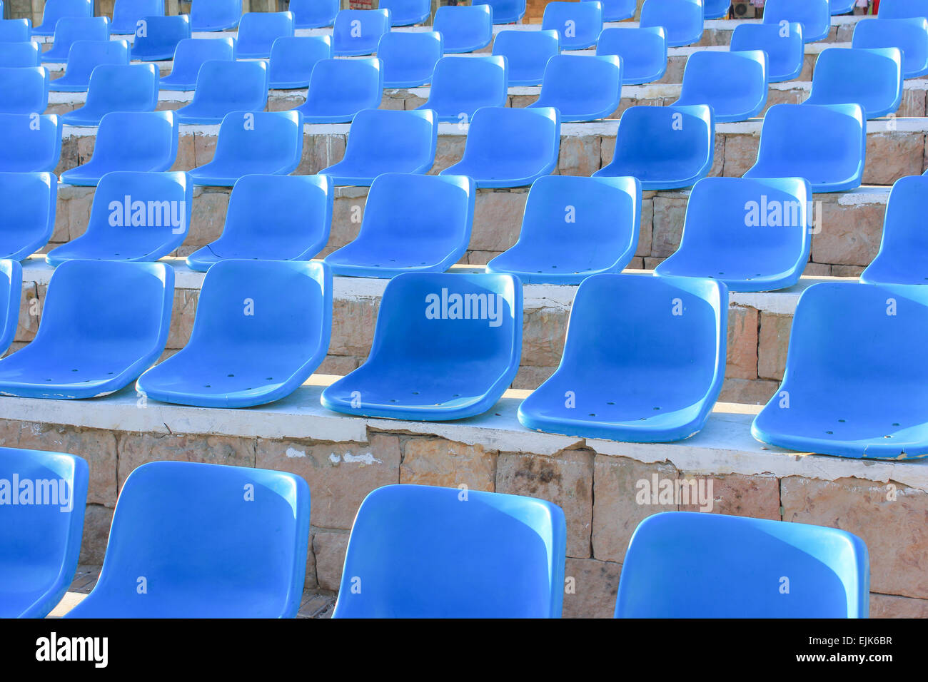 Stadium Blue Chairs at sun light Stock Photo - Alamy