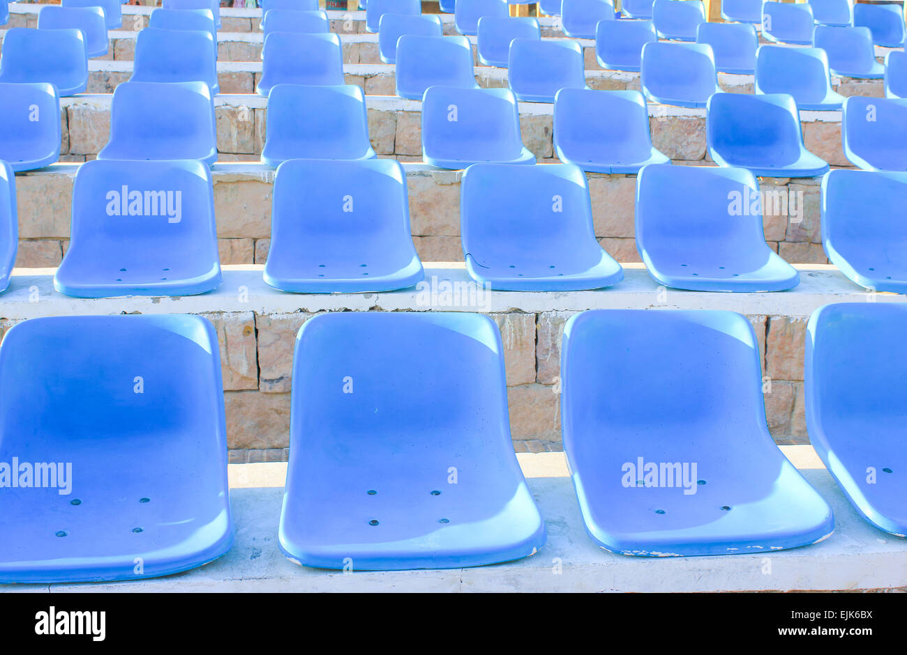 Stadium Blue Chairs at sun light Stock Photo - Alamy