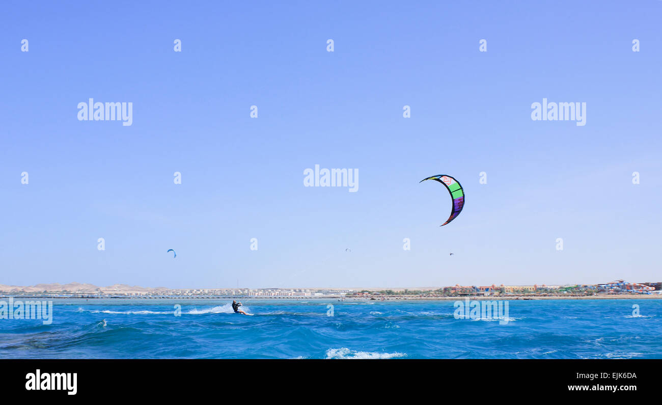 Parasail on blue sky background Stock Photo - Alamy