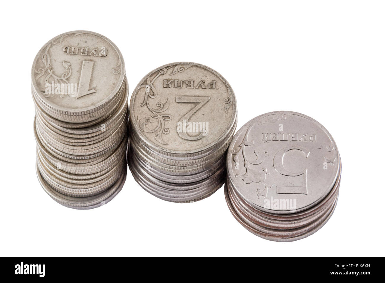 three stack of old coins on white background Stock Photo - Alamy