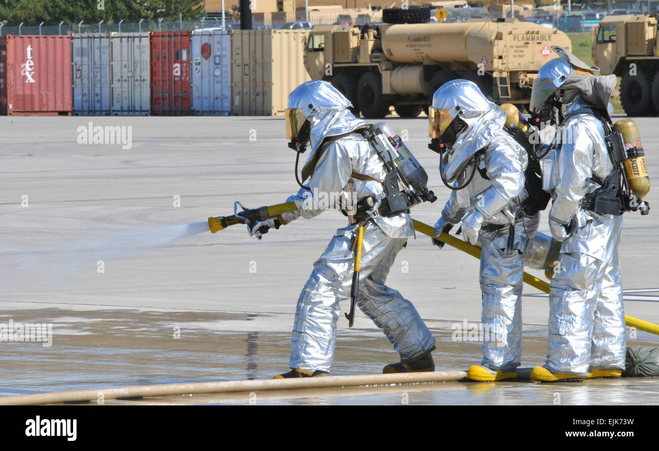 Fort Riley Firefighters execute fire containment procedures during a ...