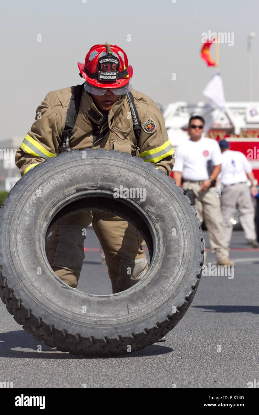 Fire Capt. Marco Sola demonstrates the tire flip event of the Fire ...