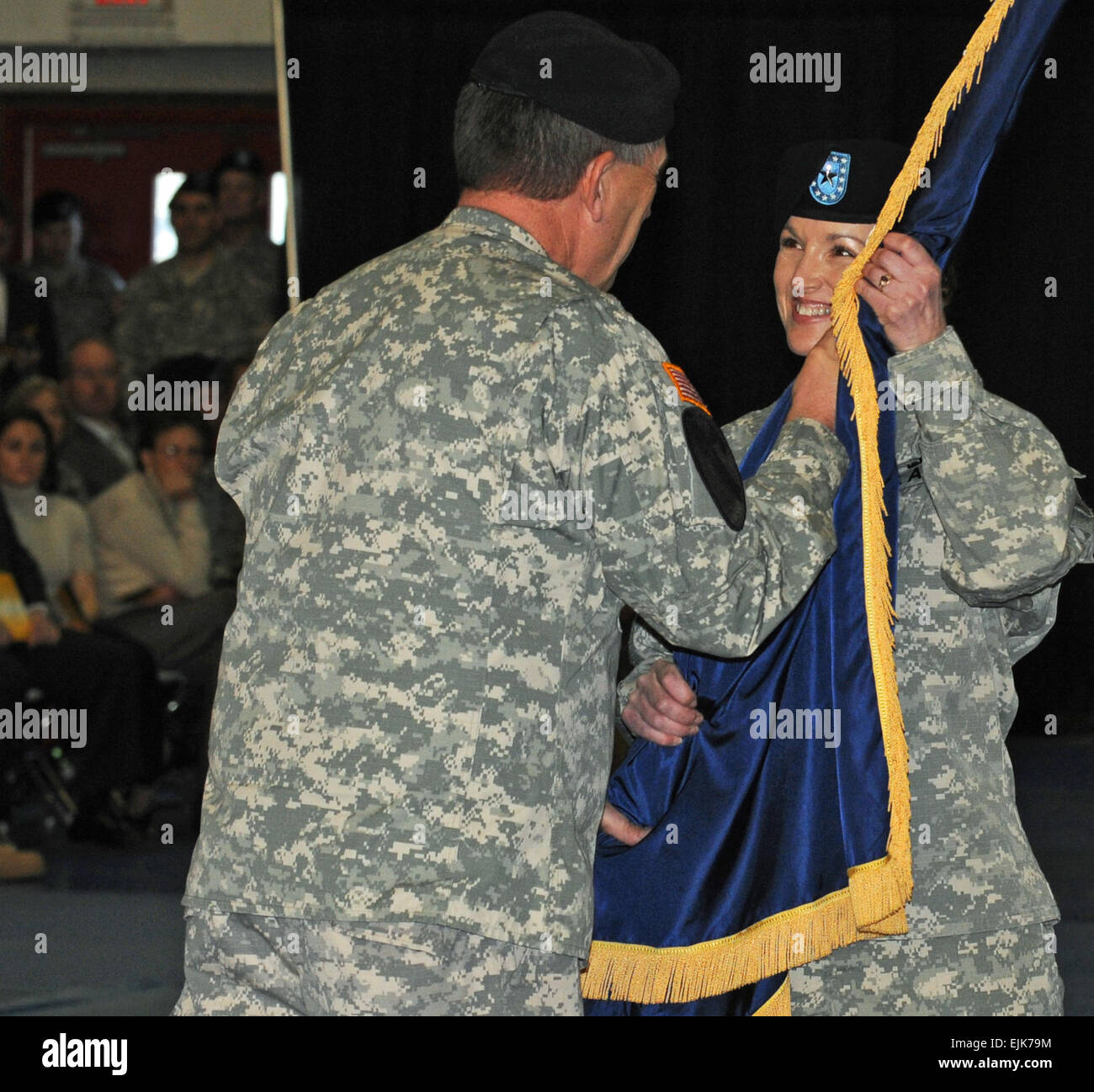 Brig. Gen. Colleen McGuire accepts the organizational colors from Army ...