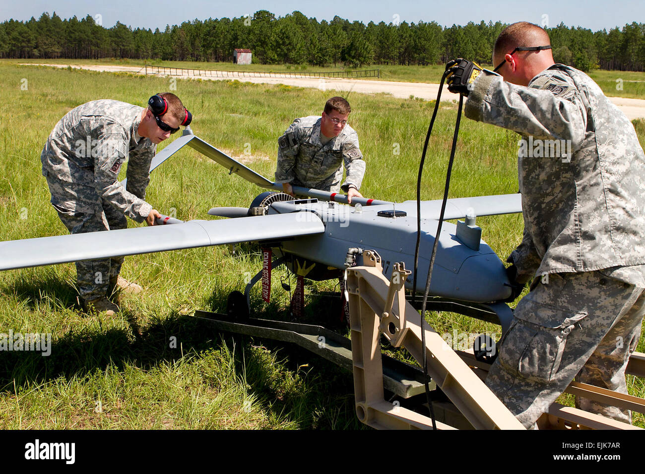 Soldiers mount a Shadow 200 unmanned aerial vehicle onto its launching ...