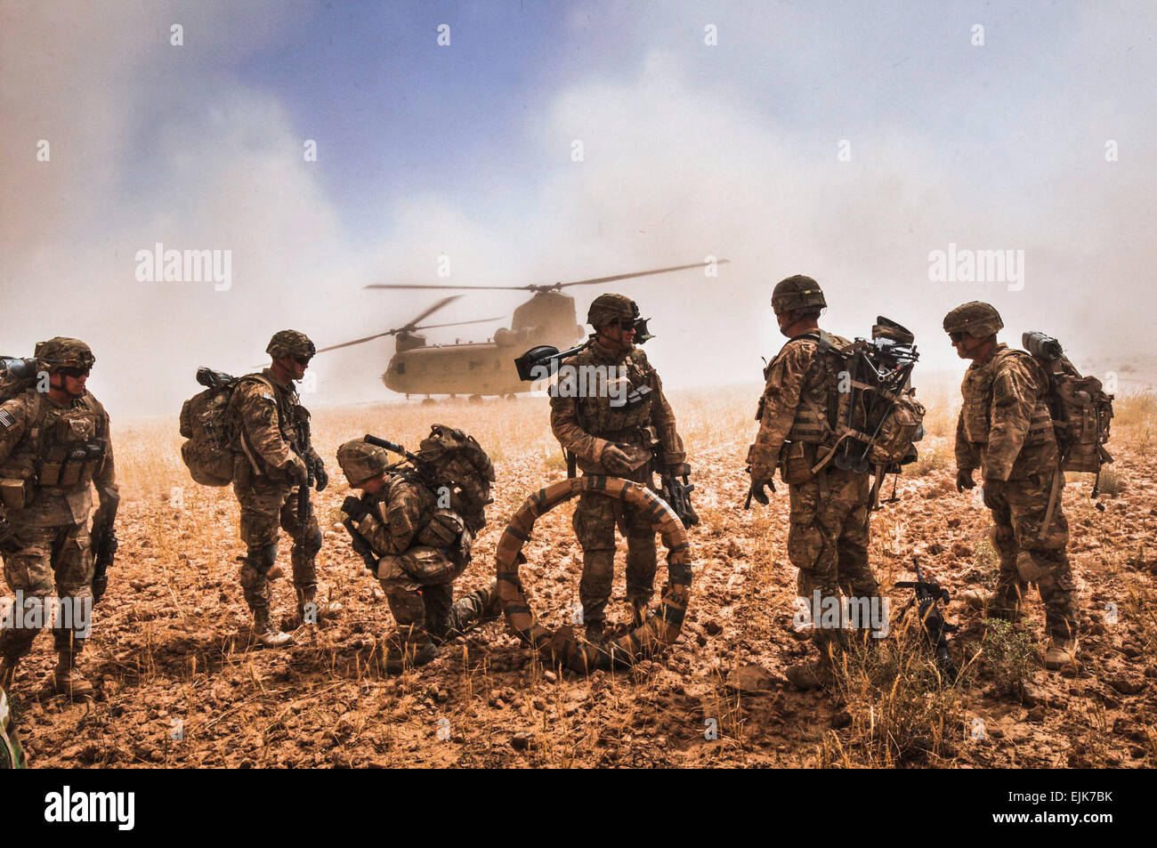 Soldiers of the 82nd Airborne Division gather their equipment before ...