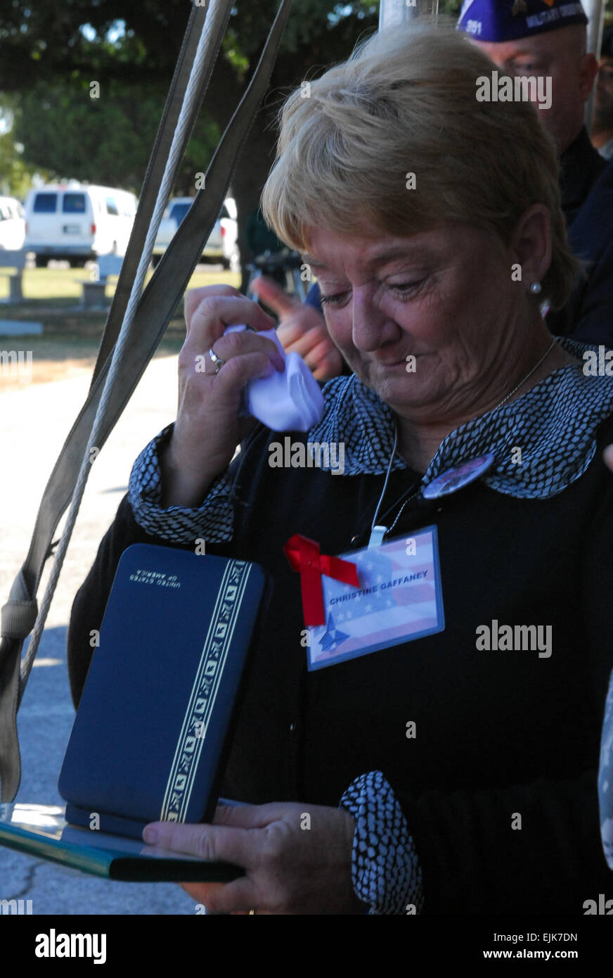Christine Gaffaney, the widow of Capt. John Gaffaney, wipes tears from ...