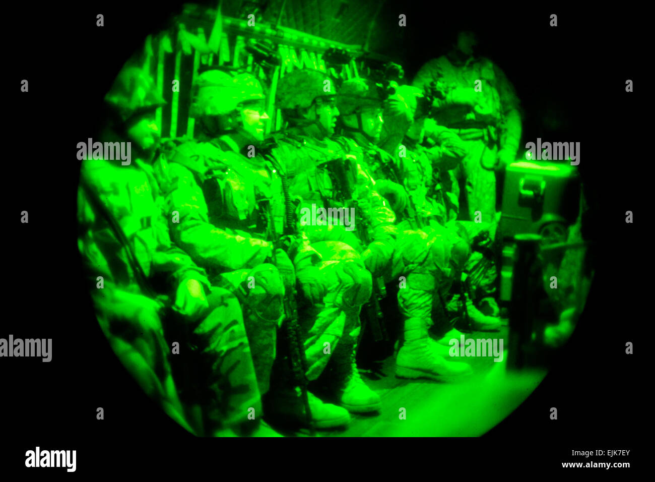 As seen through a night-viewing device, U.S. Army soldiers depart ...