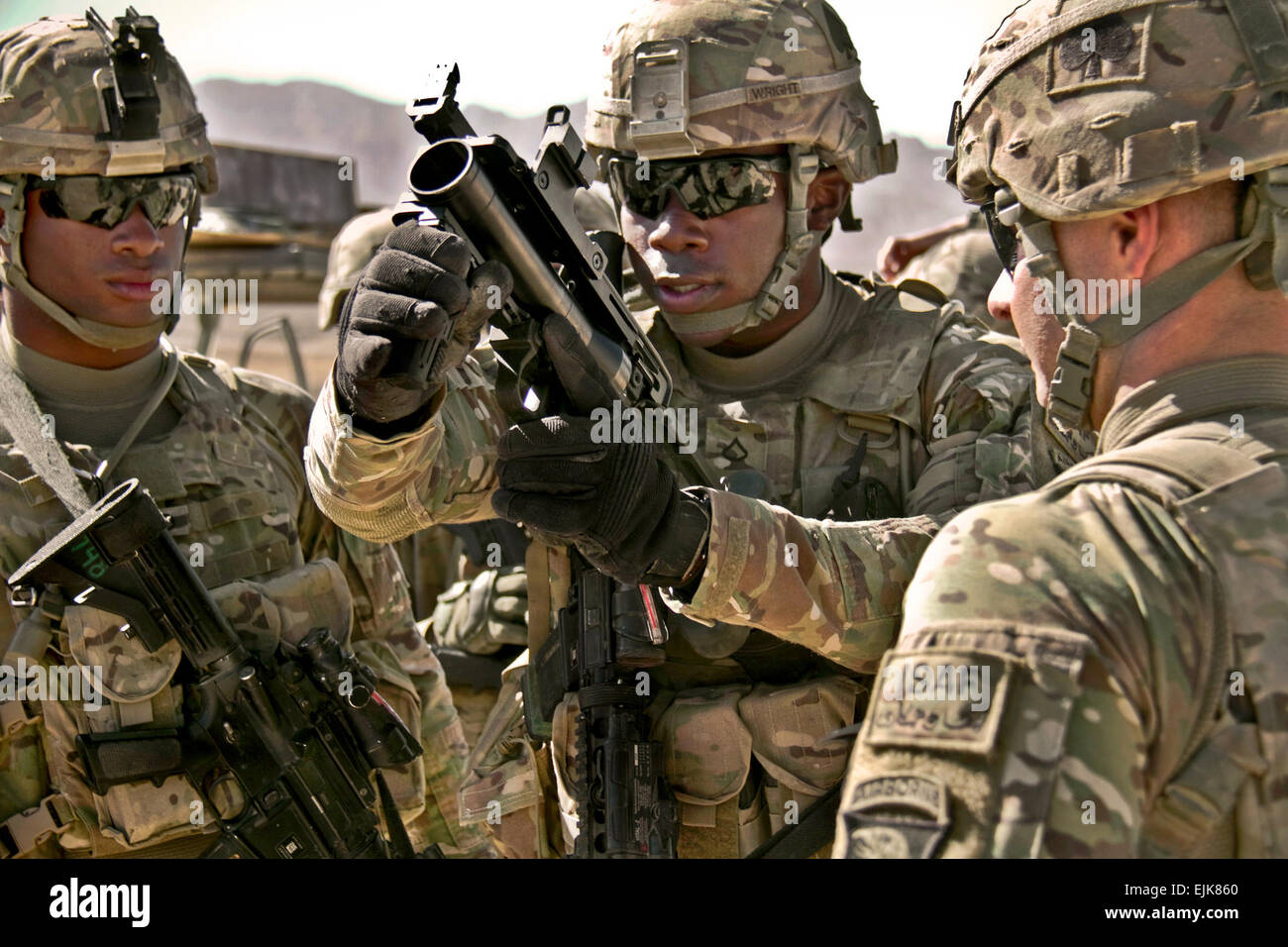 U.S. Army Pfc. Rohan Wright, center, a cavalry scout with a personal ...
