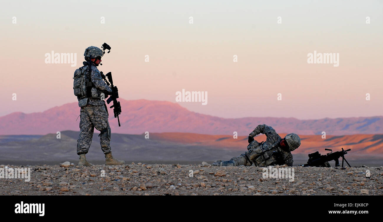 Spc. John Lombardo, left, and Spc. Christopher Keefe pull security on a ...