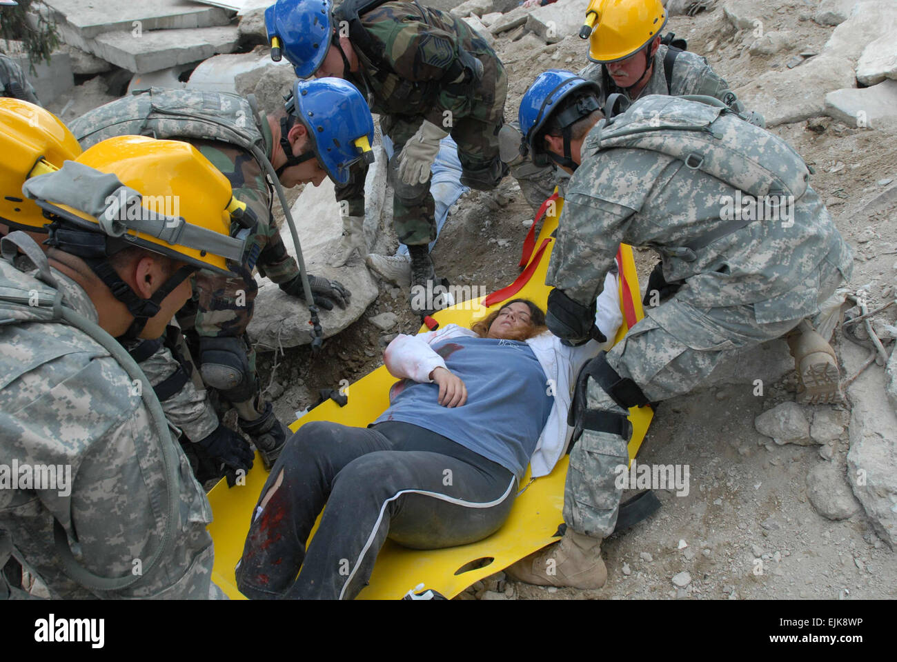 Simulated wounded are dug out of the rubble of collapsed building by ...