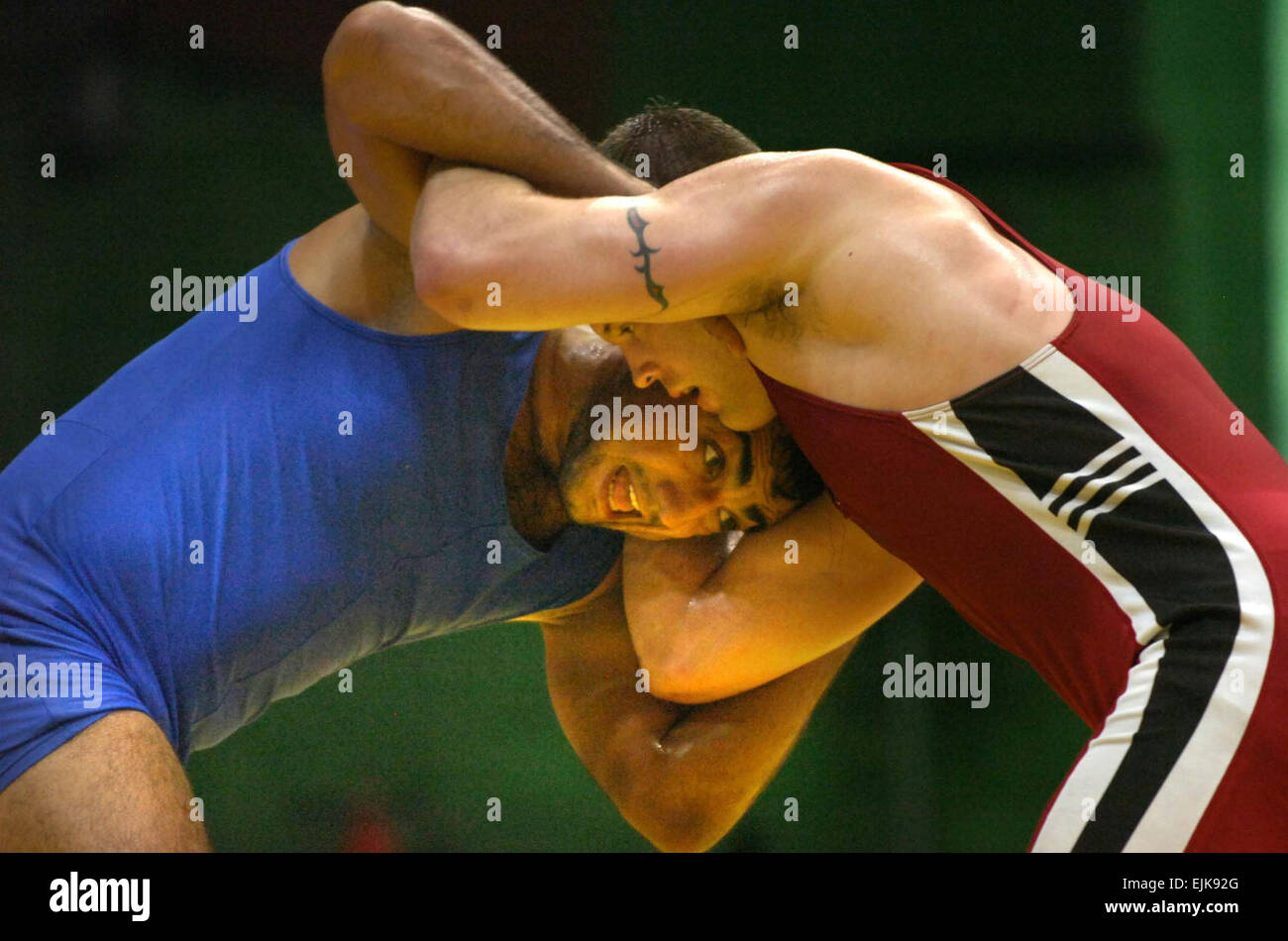 U.S. Army Sgt. Kevin Ahearn wrestles Atakishiyev Eldar, from Azerbaijan ...