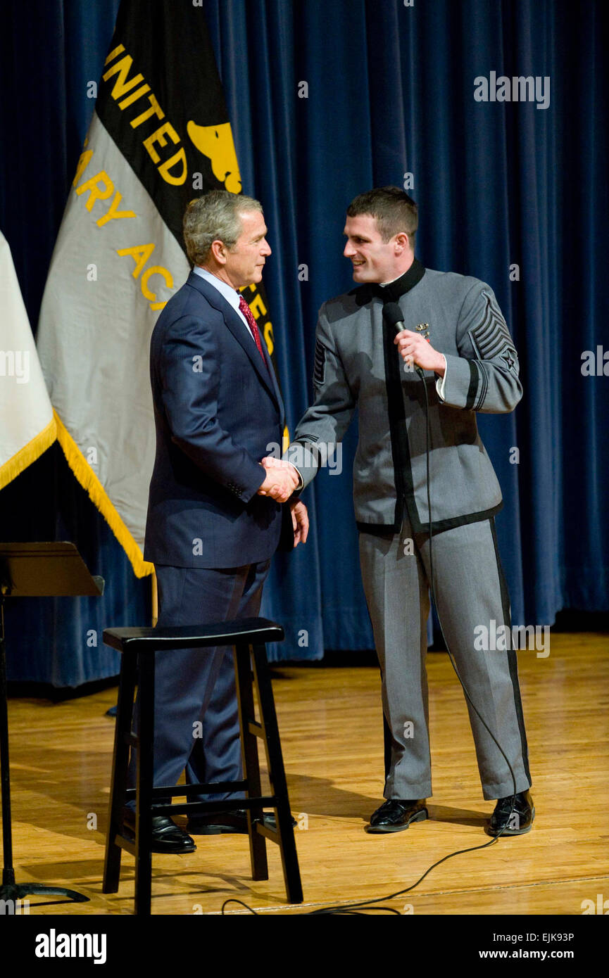 President George W. Bush shakes hands with senior Benjamin Amsler ...