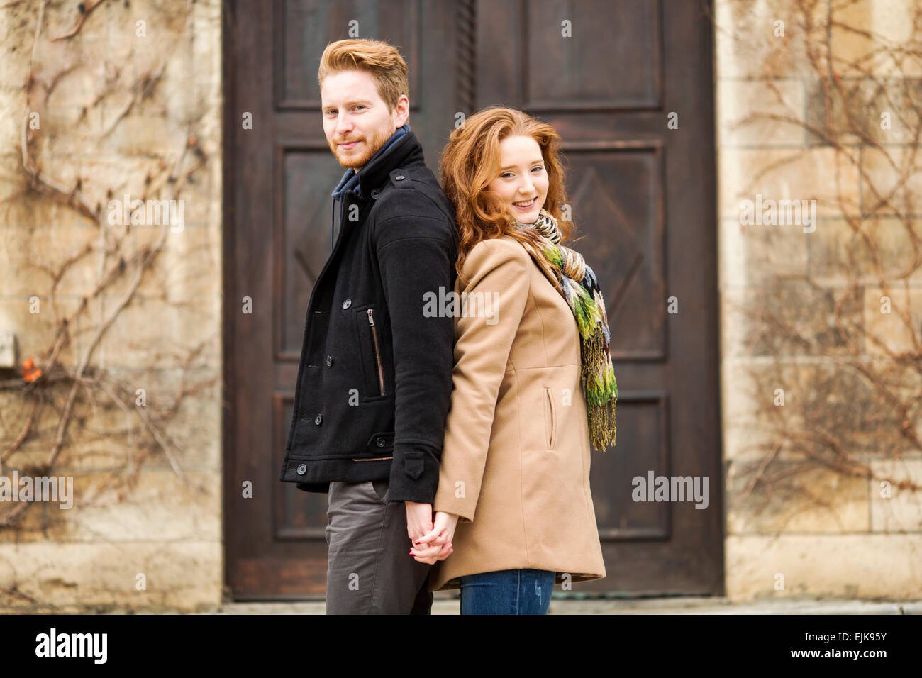 Young red hair couple at autumn park Stock Photo - Alamy