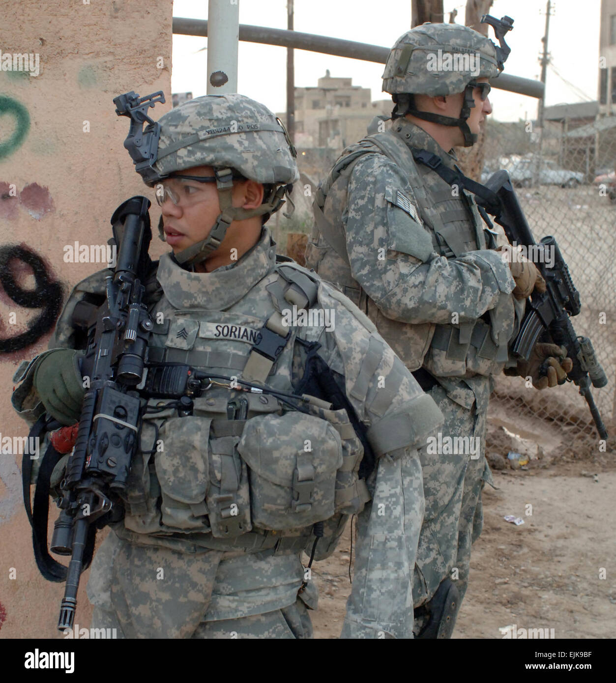 U.S. Army Sgt. Rommel Soriano, left, and Capt. Chris Halstead provide ...