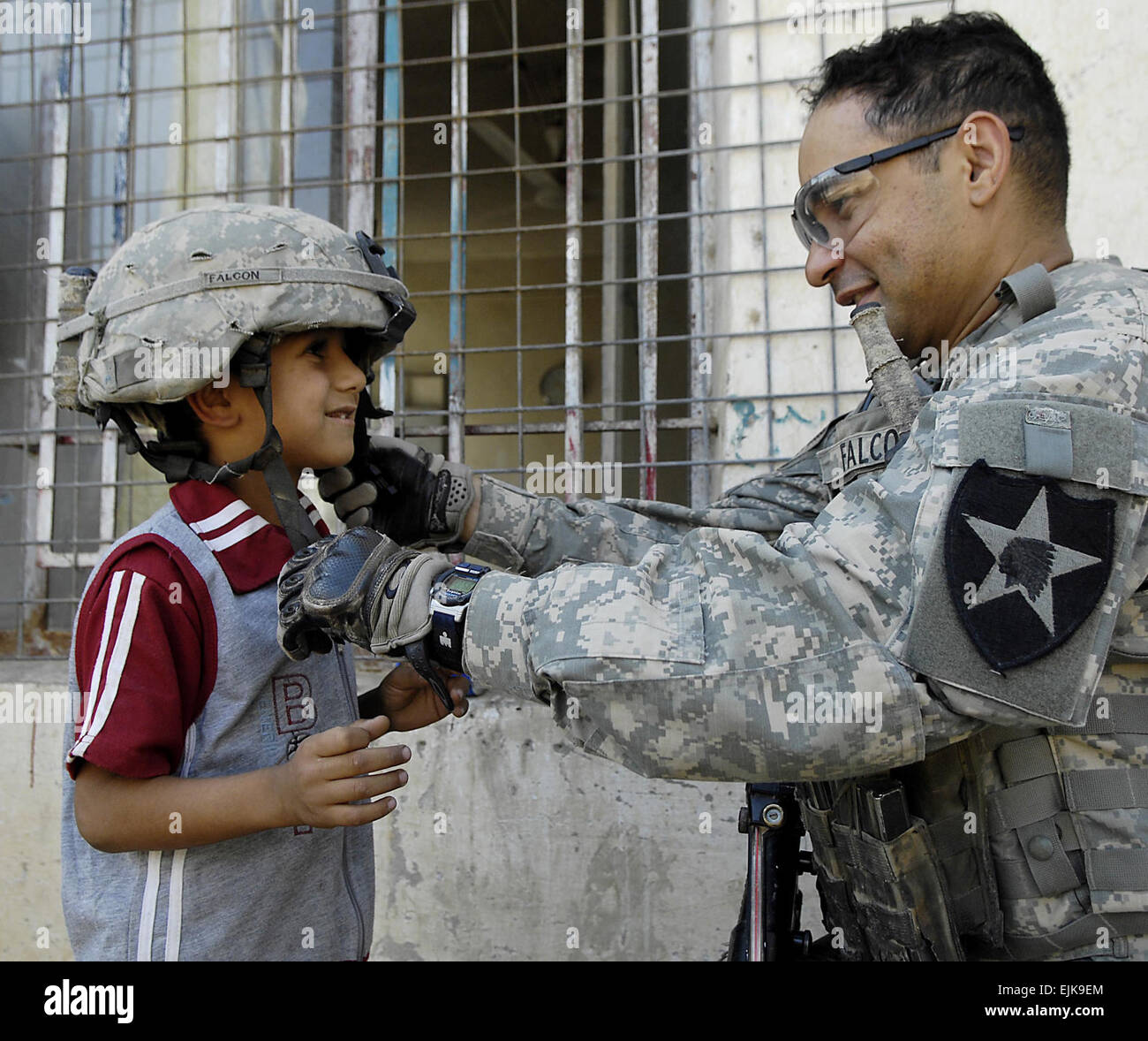 A U.S. Army Soldier interacts with an Iraqi child during a routine ...