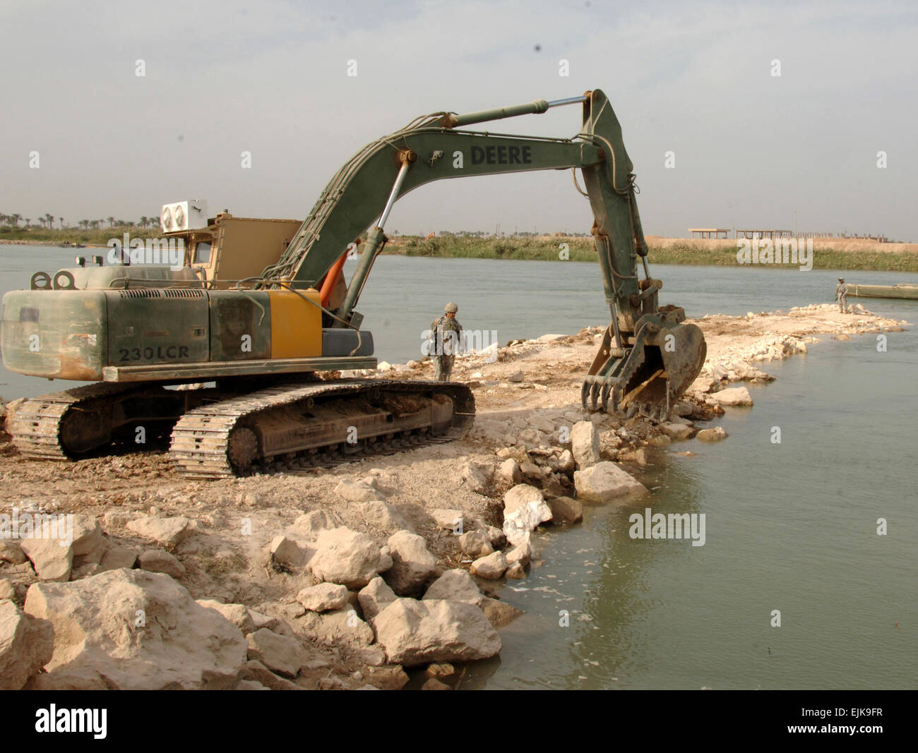 U.S. Army Soldiers from the 20th Engineer Brigade build a bridge across ...