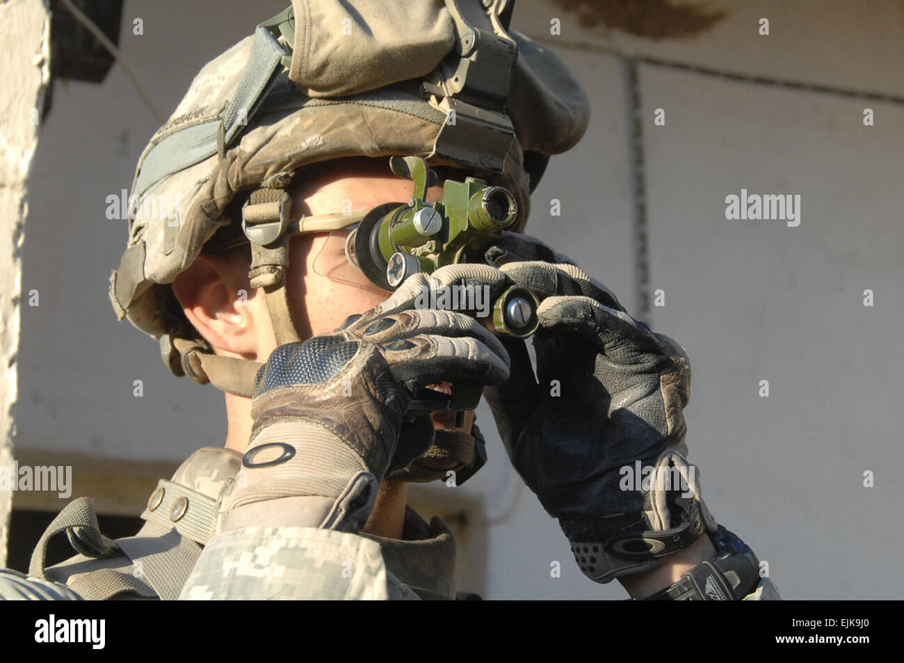 A U.S. Army Soldier looks through the scope of a rocket propelled ...