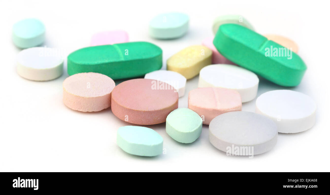 Multicolor tablets over white background Stock Photo - Alamy