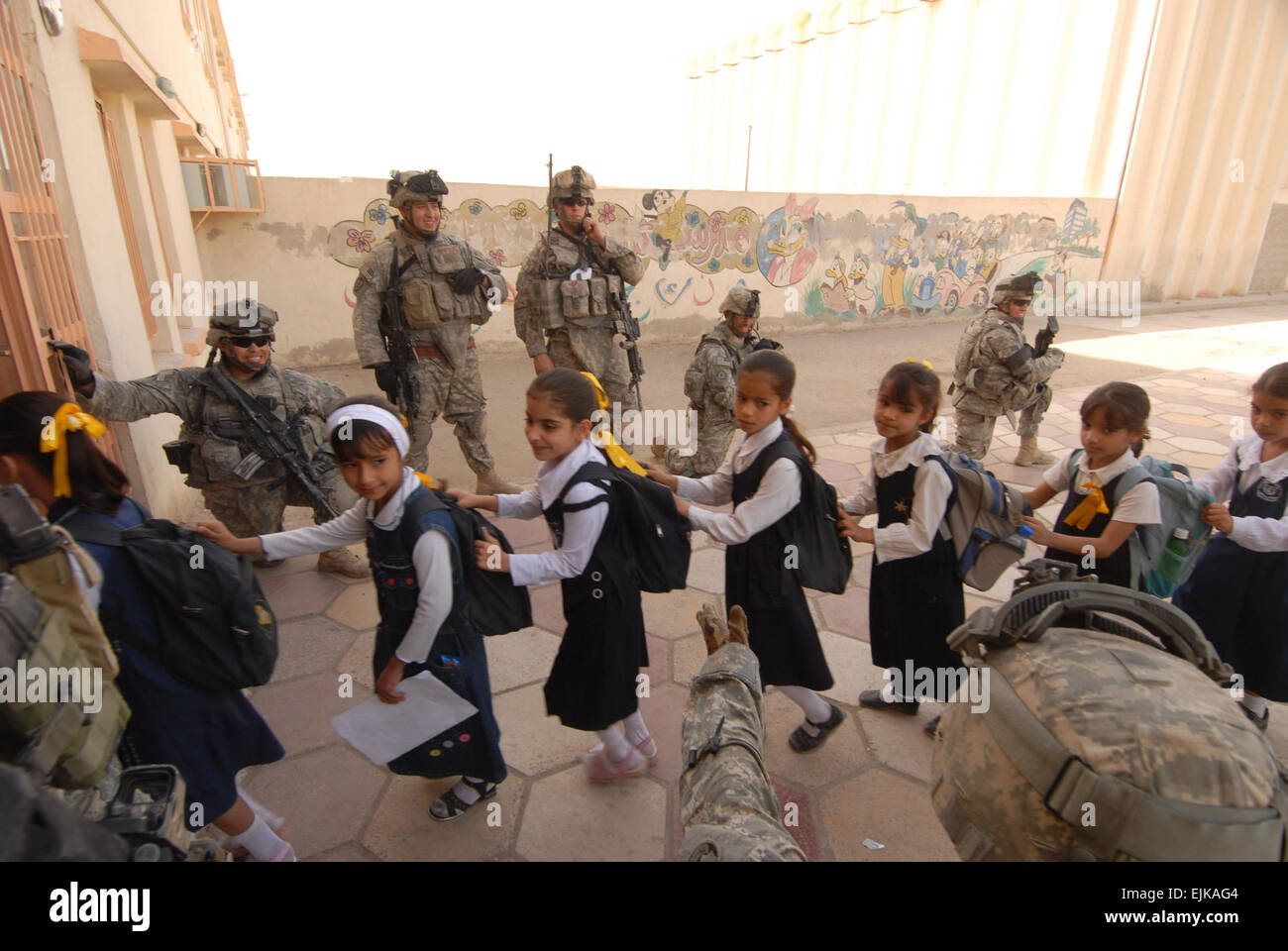 Iraqi children prepare to start their school day while U.S. Army ...