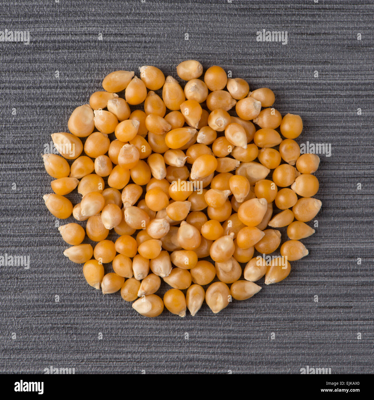 Top view of circle of corn against grey vinyl background Stock Photo ...