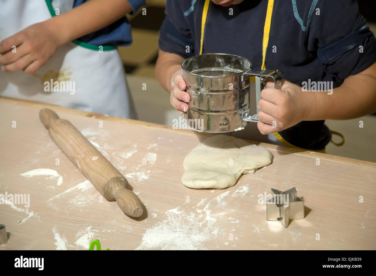 Boy making cakes in the kichen Stock Photo - Alamy