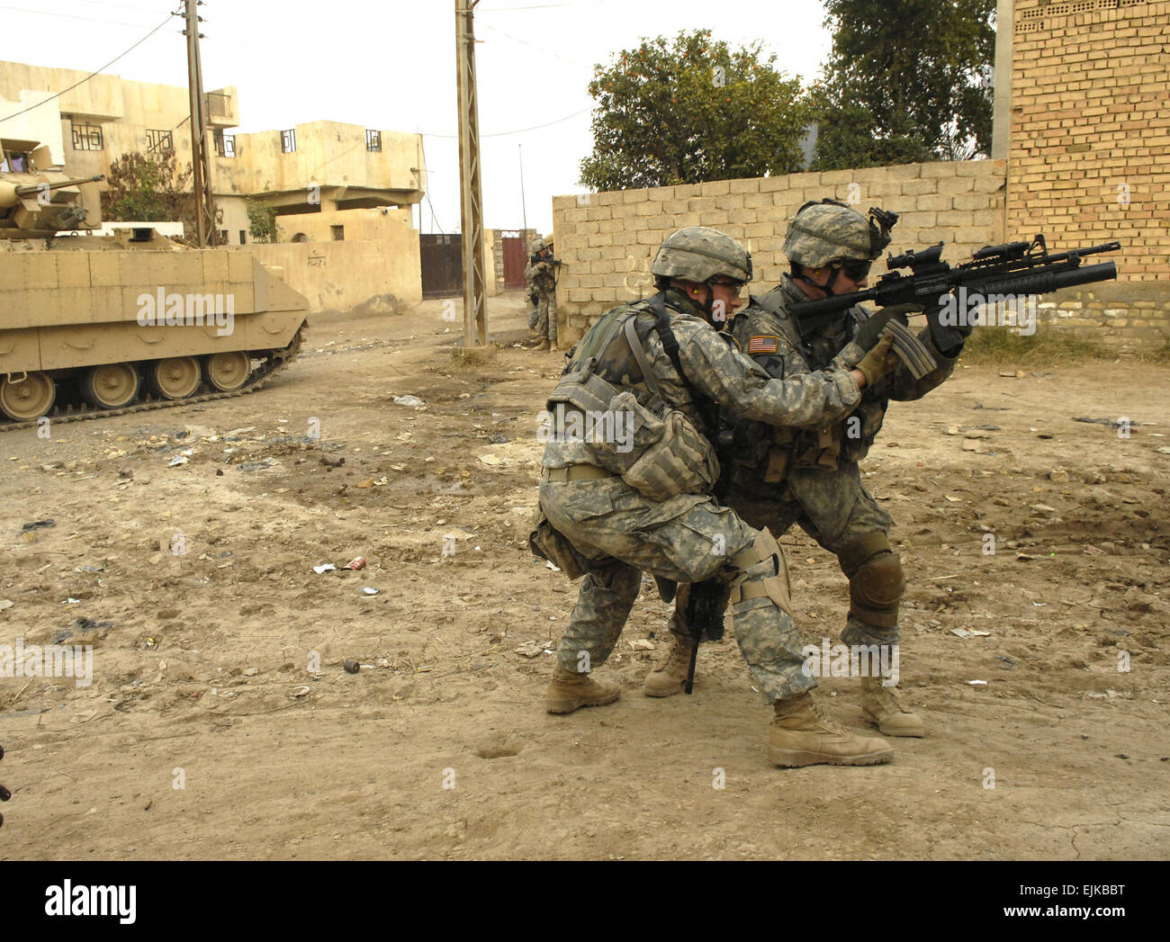 U.S. Army Spcs. William McGrath and Cory Barton conduct a foot patrol ...