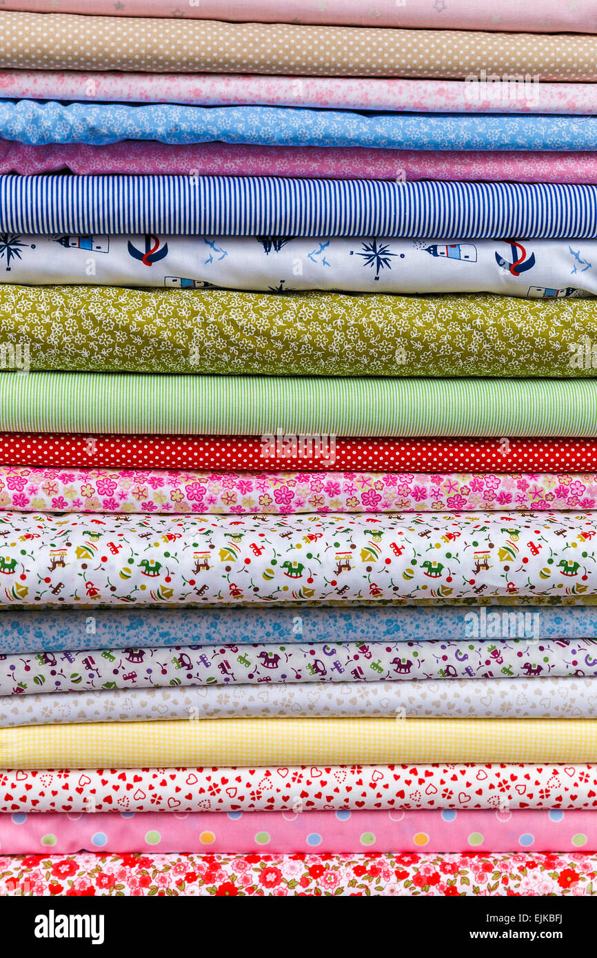 Rolls of colored fabrics Stock Photo - Alamy