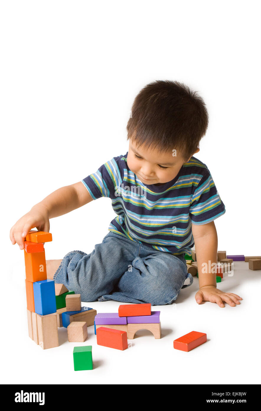 Asian preschooler building with wooden blocks Stock Photo - Alamy