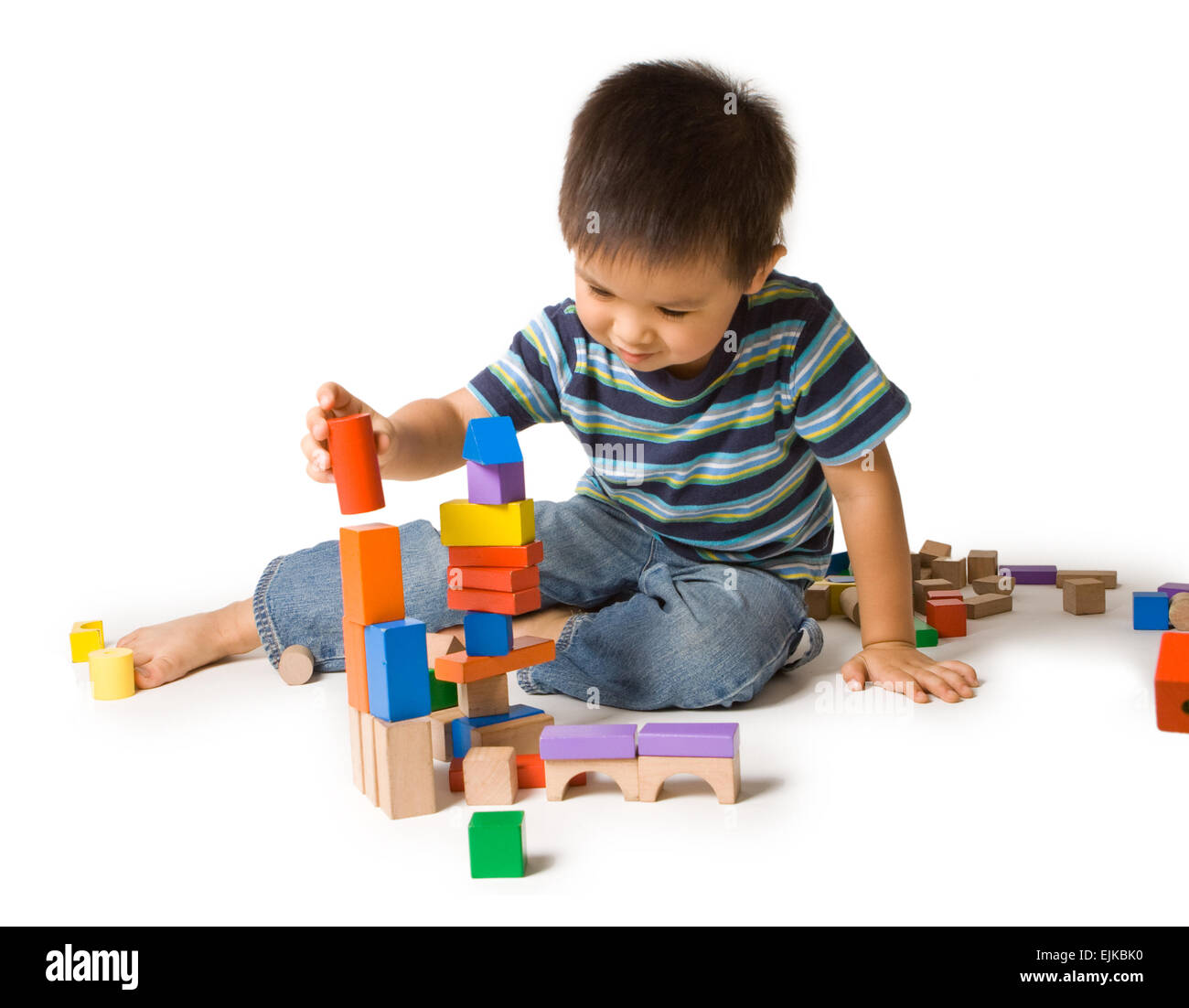 Asian preschooler building with wooden blocks Stock Photo - Alamy