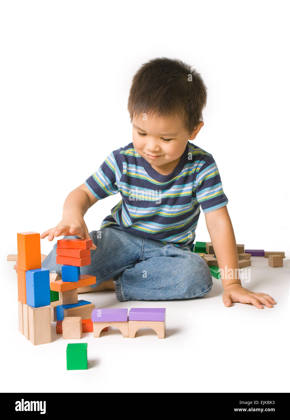 Asian preschooler building with wooden blocks Stock Photo - Alamy