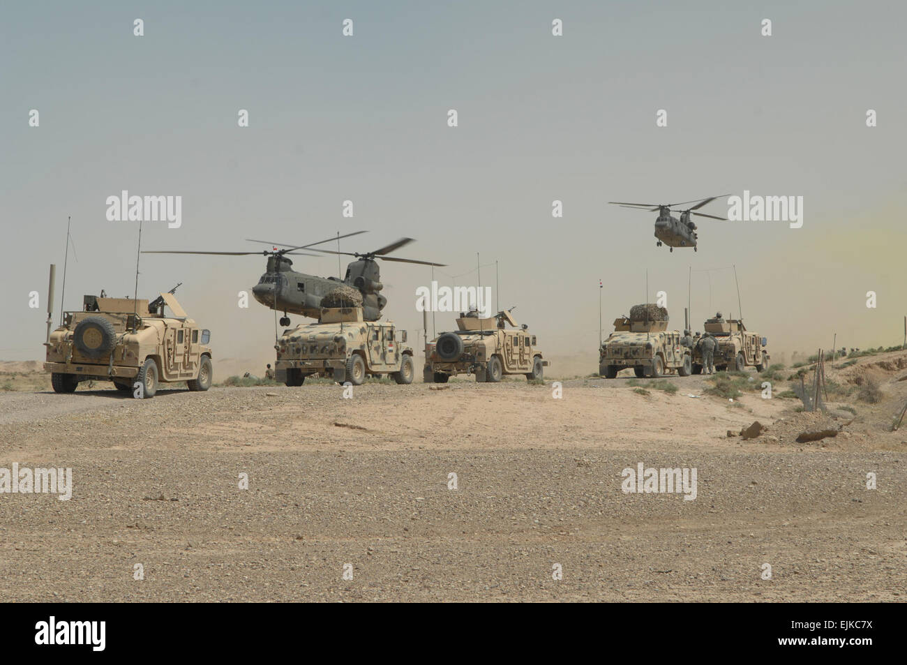 CH-47 Chinook helicopters land outside of the village of Abd al Hasan ...