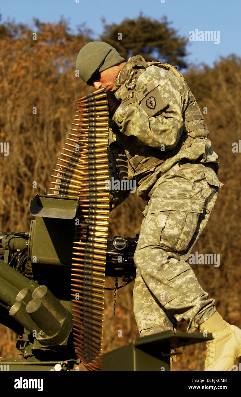 U.S. Army Cpl. Jeffrey MacDonald loads a Stryker armored vehicle with ...