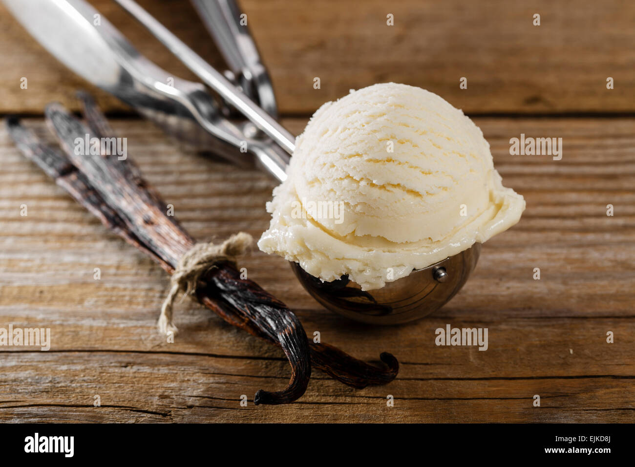 ball of vanilla ice cream in a spoon scoop Stock Photo - Alamy